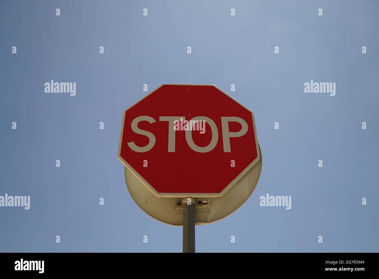 Warning "Stop" sign against the sunny sky Stock Photo - Alamy