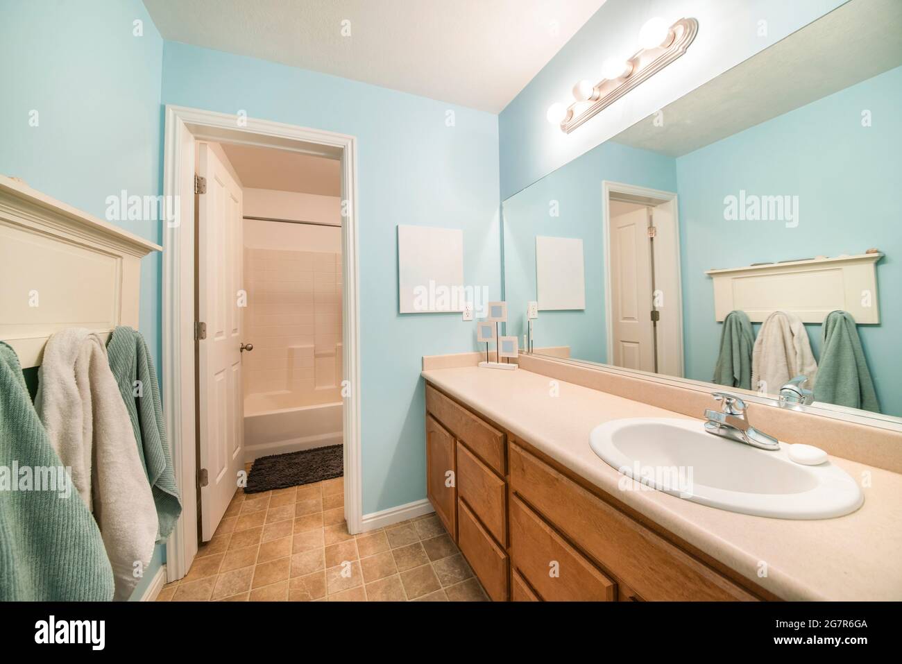 Bathroom interior with sky blue wall with a room for a bathtub Stock ...