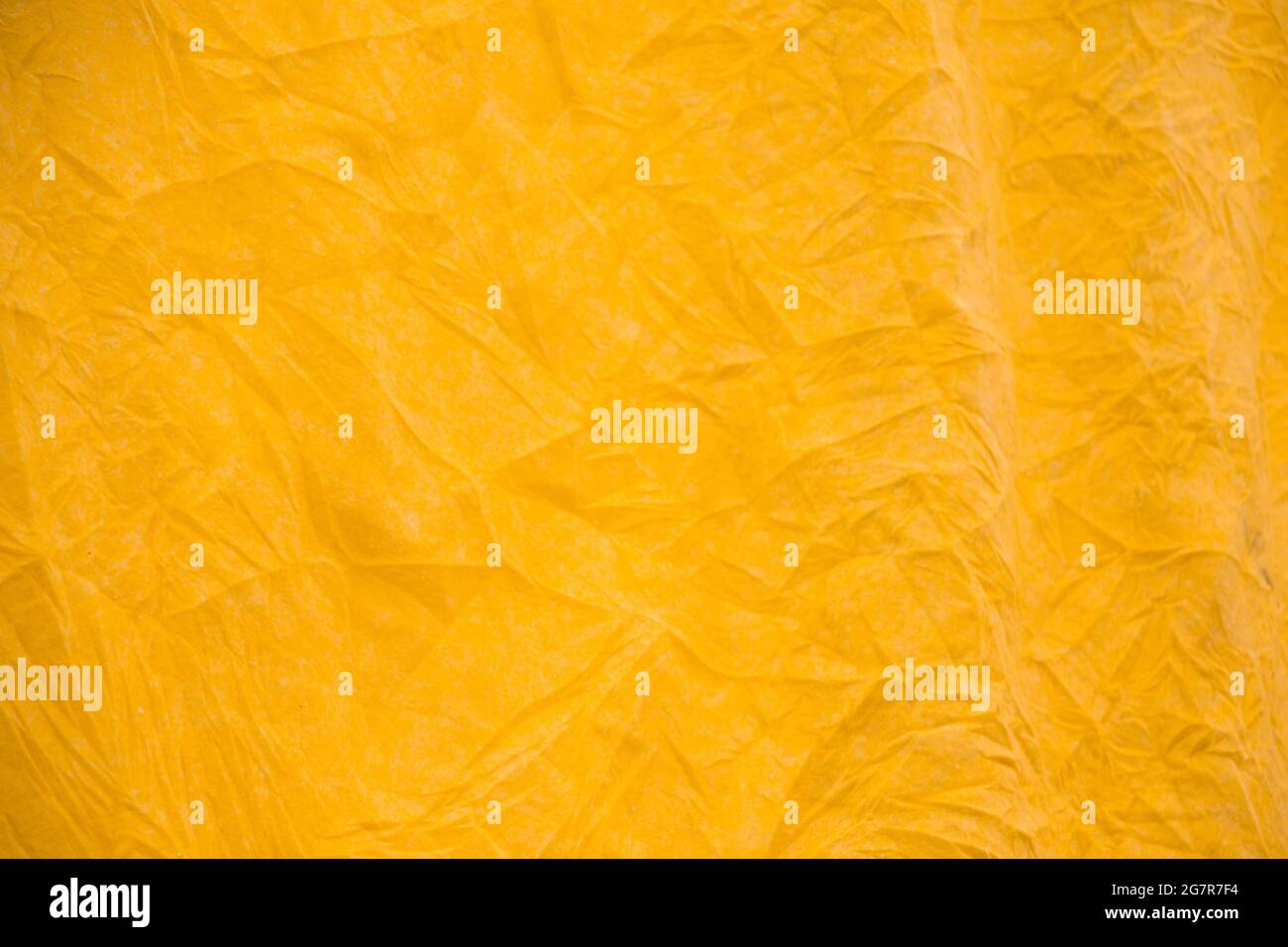 Illustration of a yellow crumpled paper background Stock Photo - Alamy