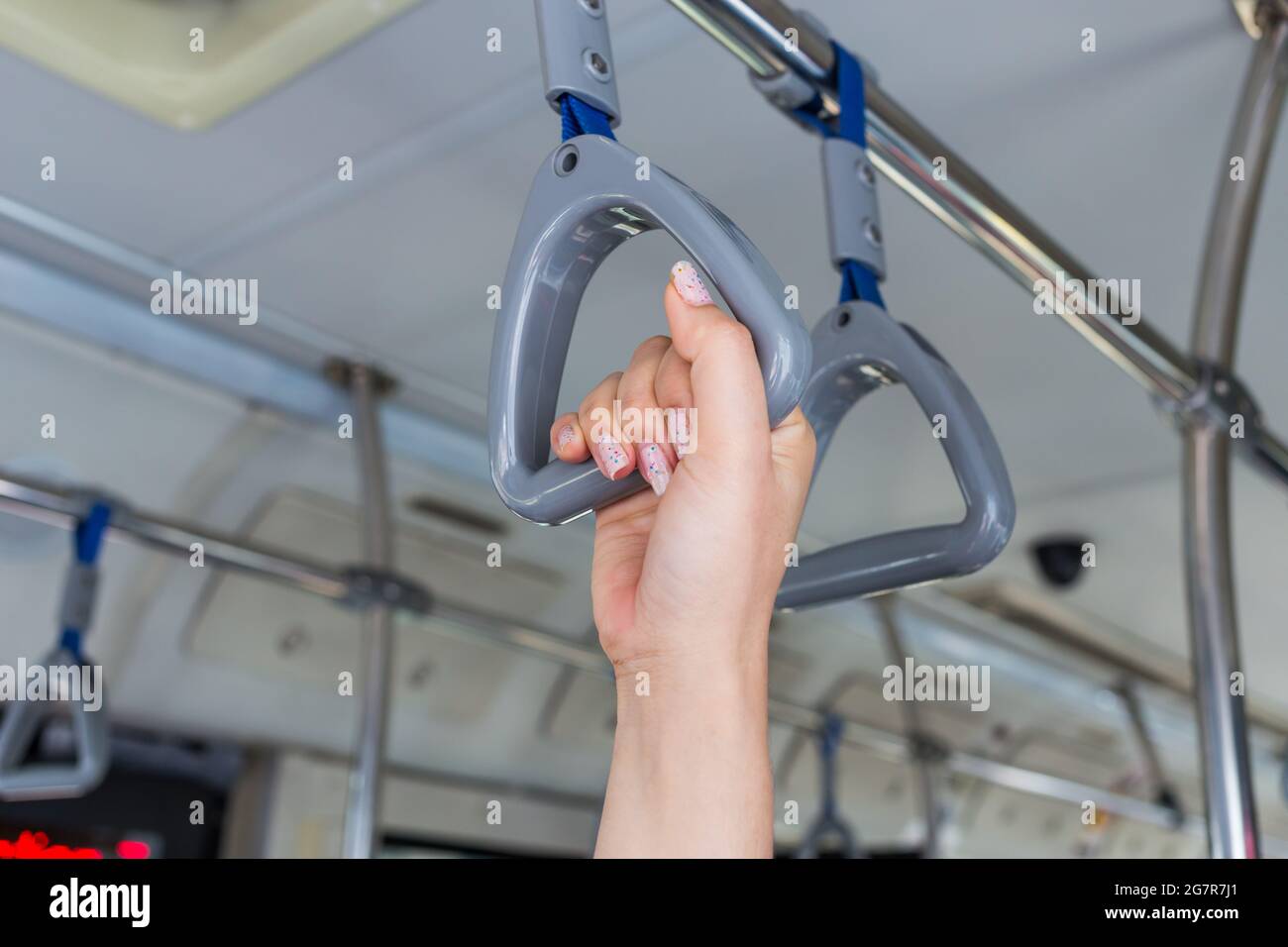 Women hand handle loop in the subway Stock Photo - Alamy