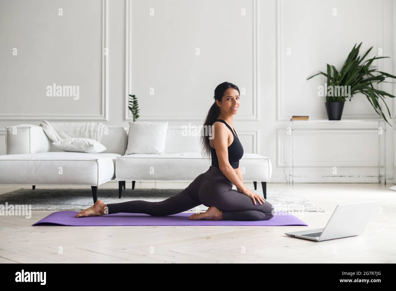 Doing asanas hi-res stock photography and images - Alamy