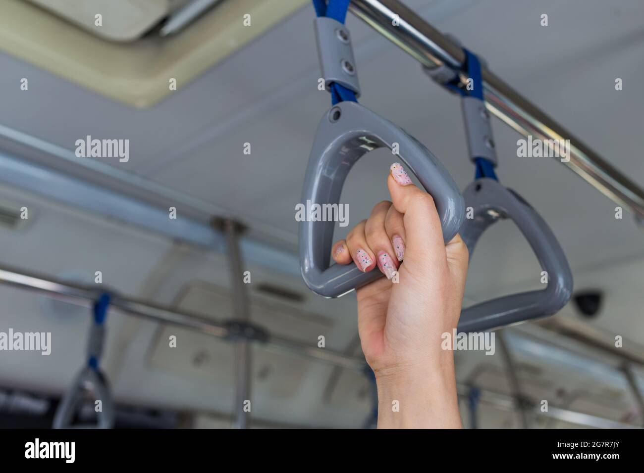 Women hand handle loop in the subway Stock Photo - Alamy