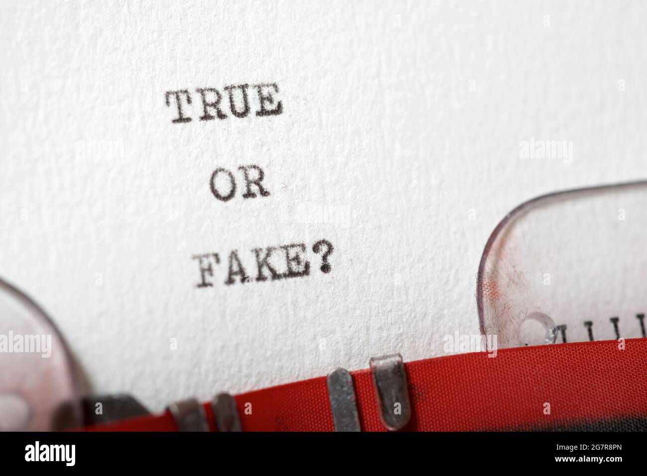 True or fake? phrase written with a typewriter Stock Photo - Alamy