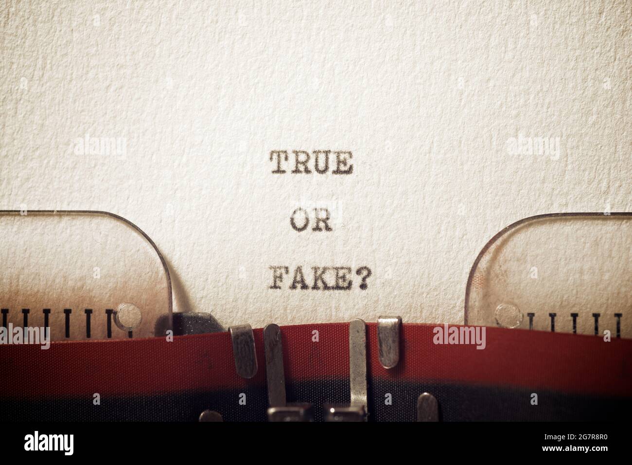 True or fake? phrase written with a typewriter Stock Photo - Alamy