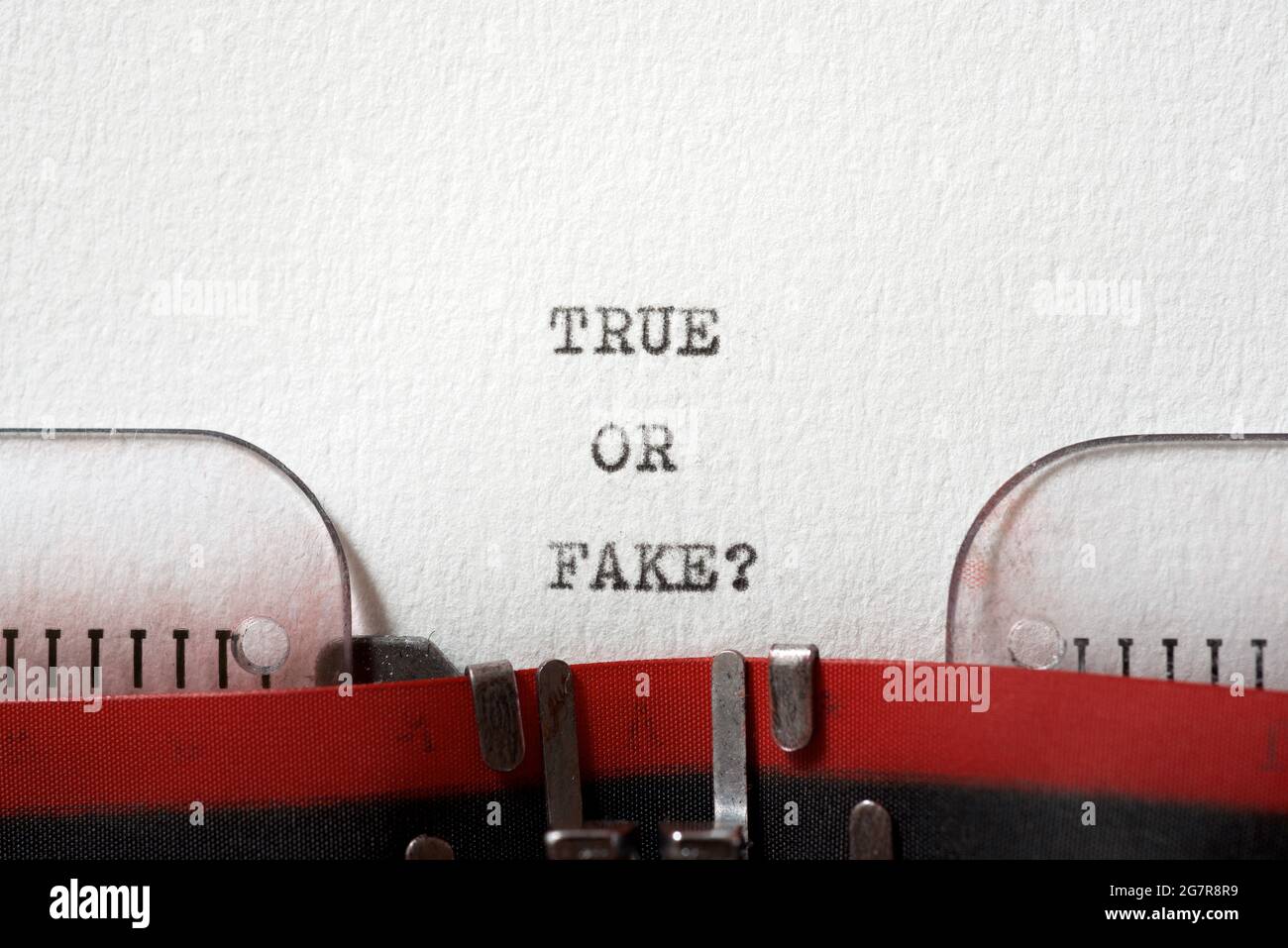 True or fake? phrase written with a typewriter Stock Photo - Alamy