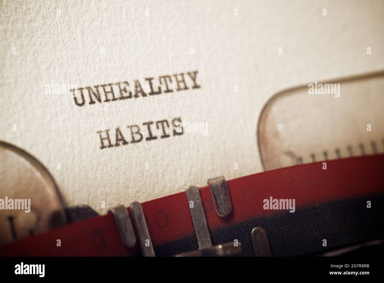 Unhealthy habits phrase written with a typewriter Stock Photo - Alamy