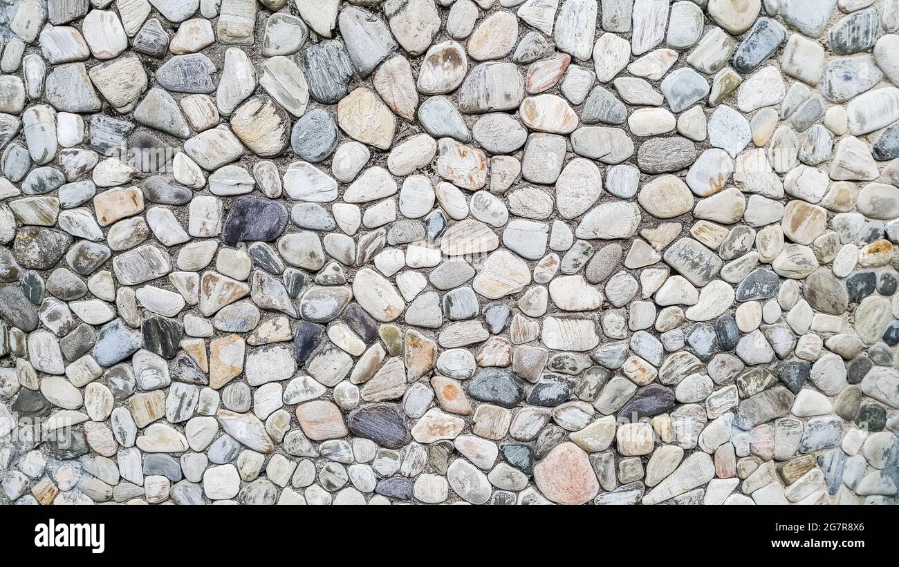 Old river rock wall texture background Stock Photo - Alamy