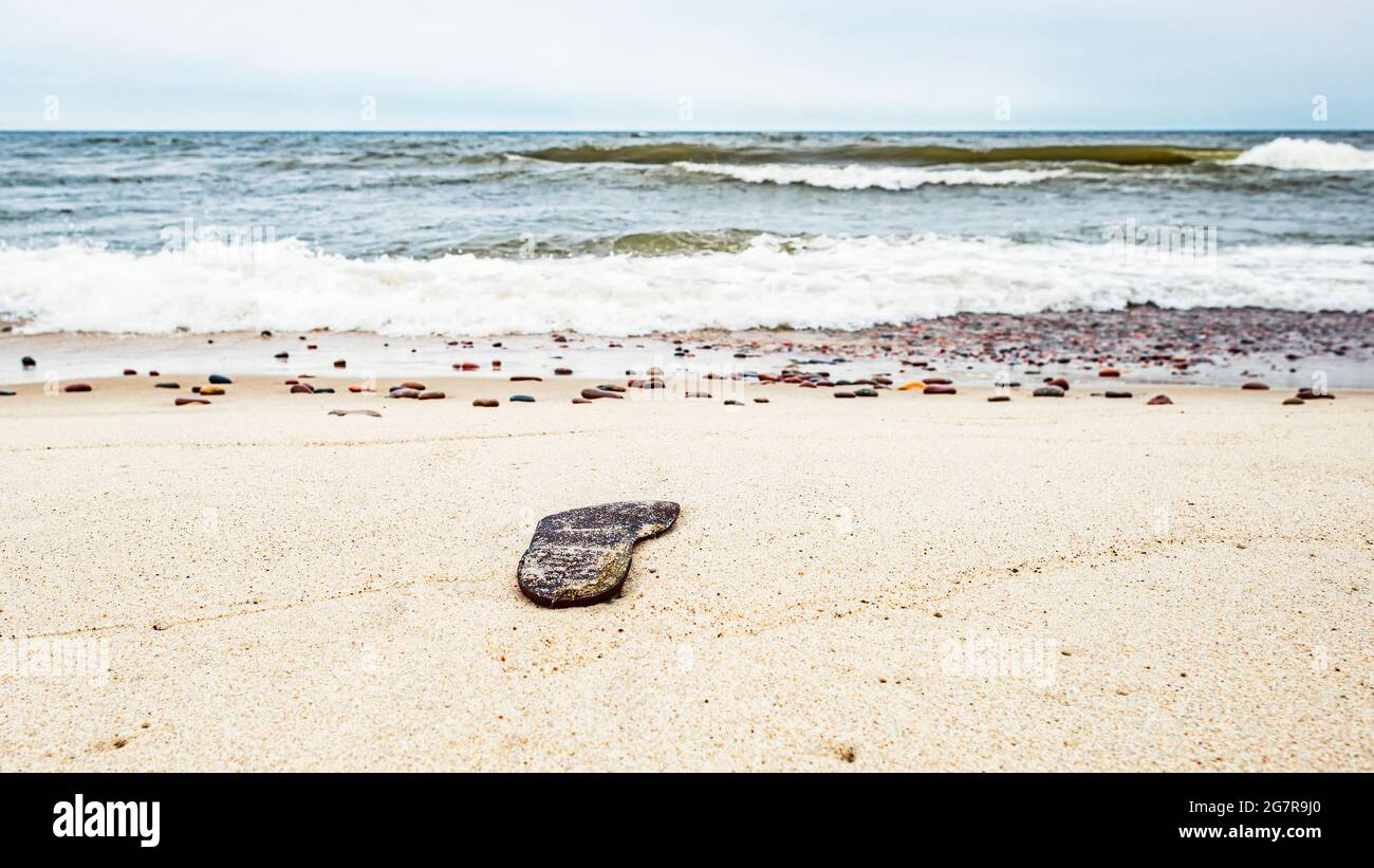 The sole of a shoe, thrown on the seashore on the beach Stock Photo - Alamy