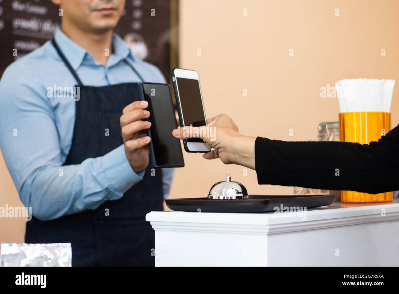 People using smartphone mobile banking scan QR code to pay in shop ...