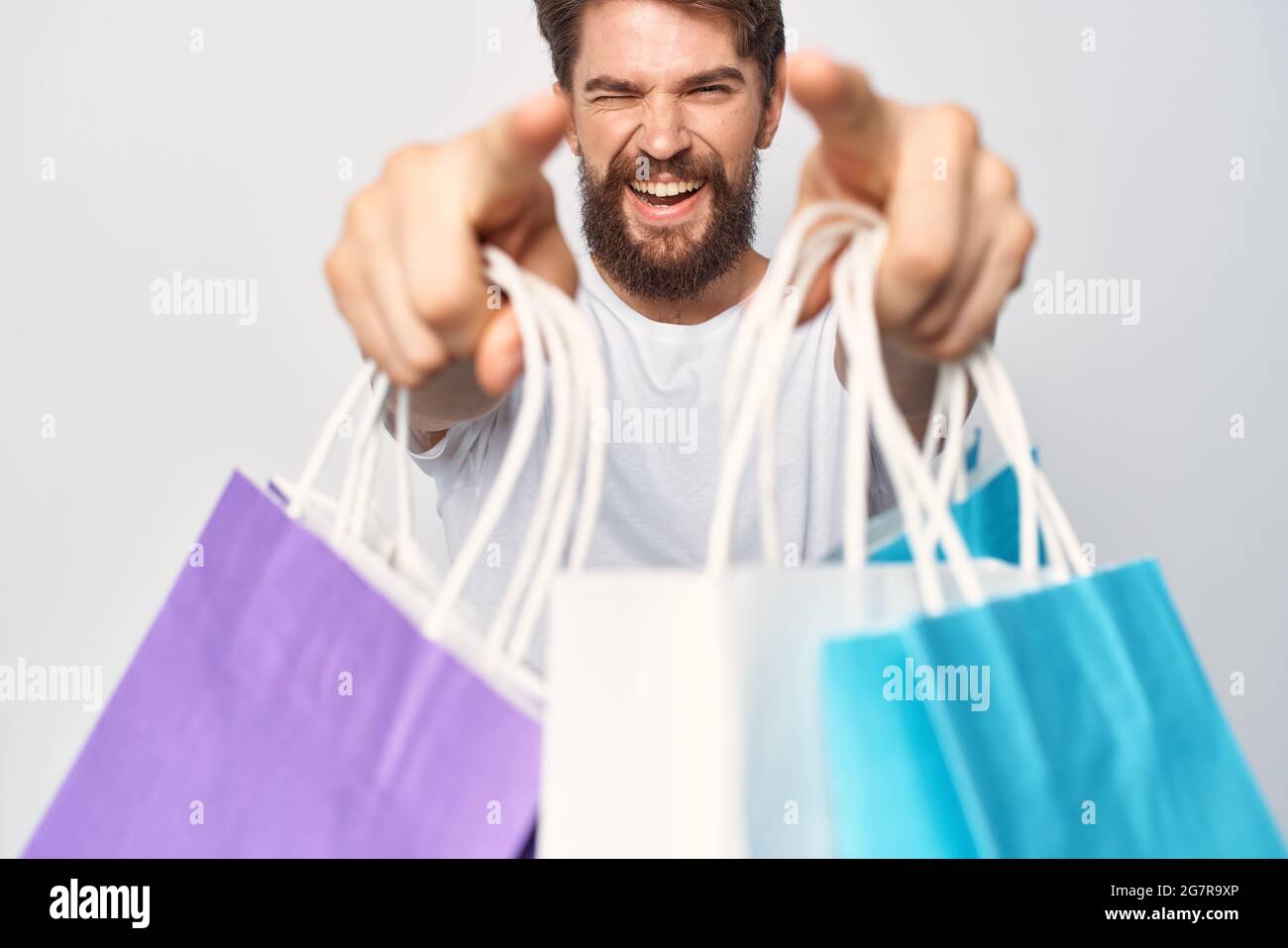 Man bags in teeth hi-res stock photography and images - Alamy