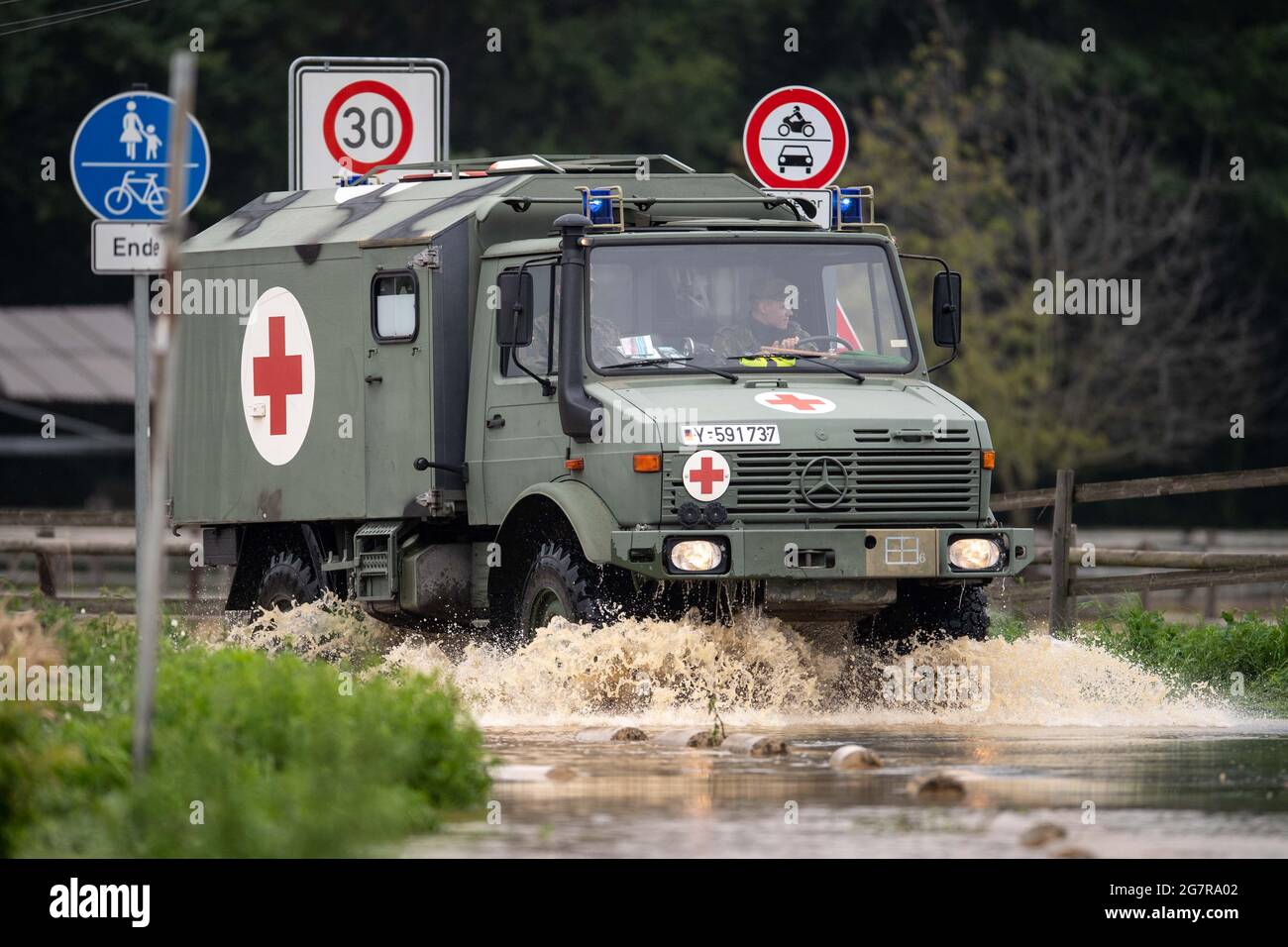 Erftstadt, Germany. 16th July, 2021. A Bundeswehr ambulance drives over ...