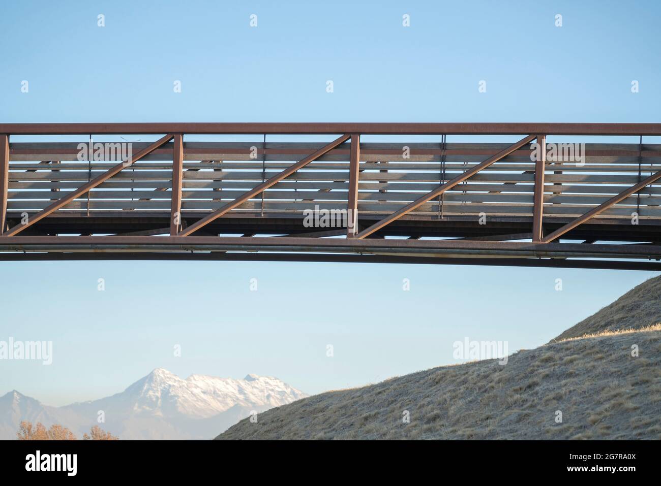 Selective focus of a footbridge with metal and wooden railings Stock ...
