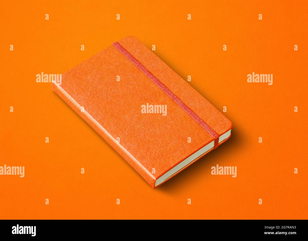 Orange closed notebook mockup isolated on color background Stock Photo ...