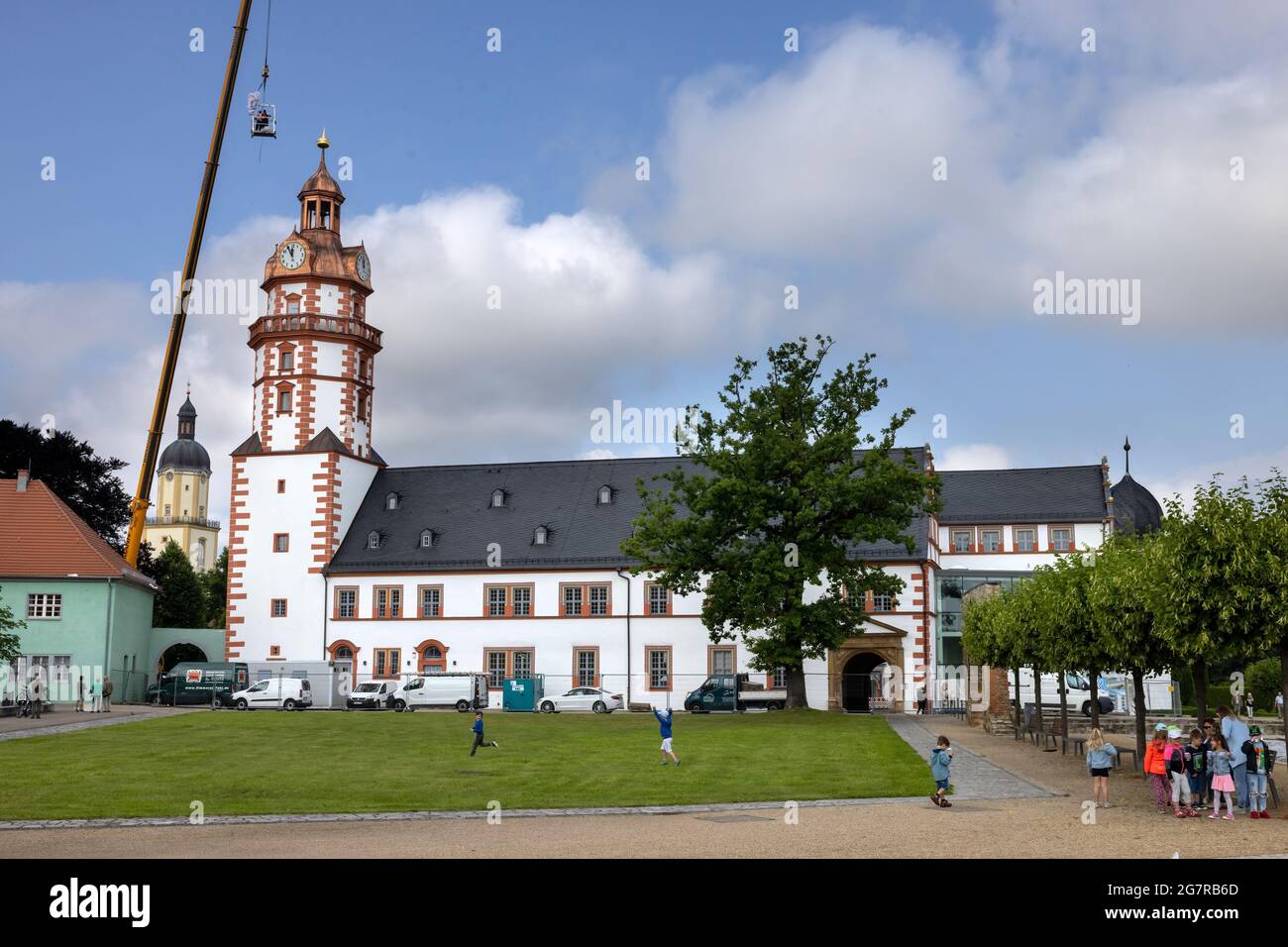 Ohrdruf, Germany. 16th July, 2021. Carpenters put the five gilded tower ...