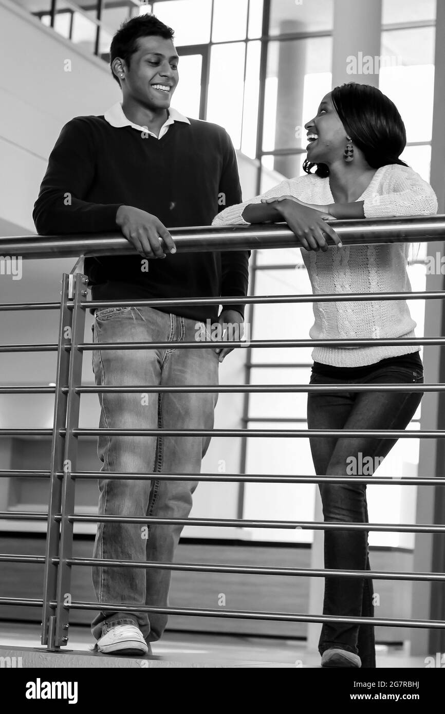 Two students talking class Black and White Stock Photos & Images - Alamy