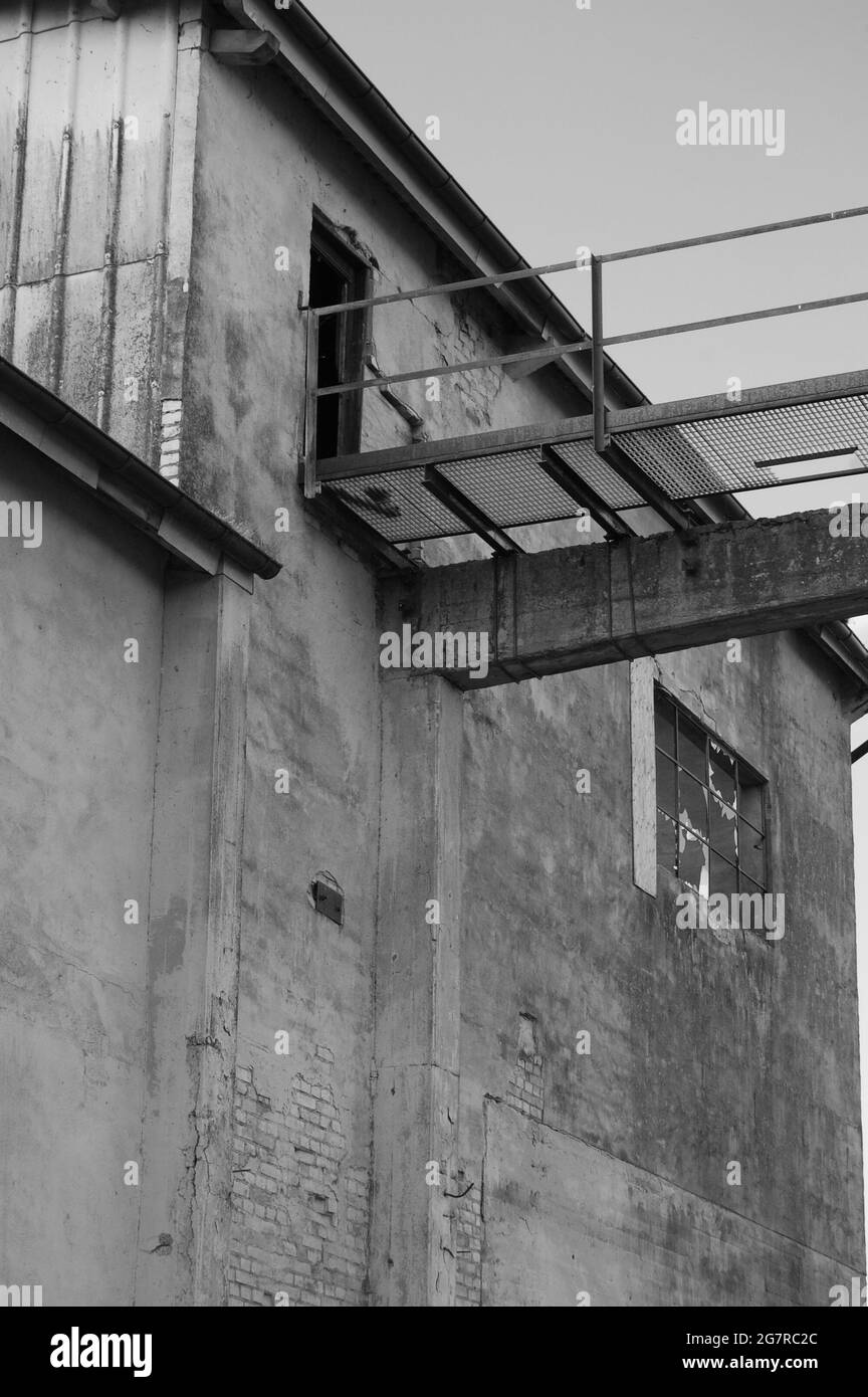 Vertical shot of an old abandoned factory building Stock Photo - Alamy