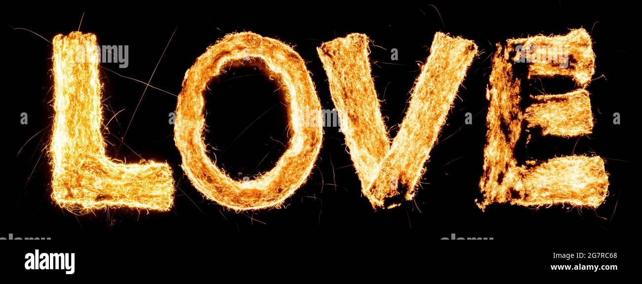 Word LOVE burning. Fibers lines smoldering. Beautiful combustion ...