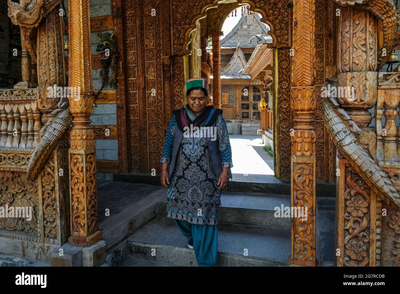 Kalpa, India - July 2021: A woman leaving the Hindu temple of Narayan ...