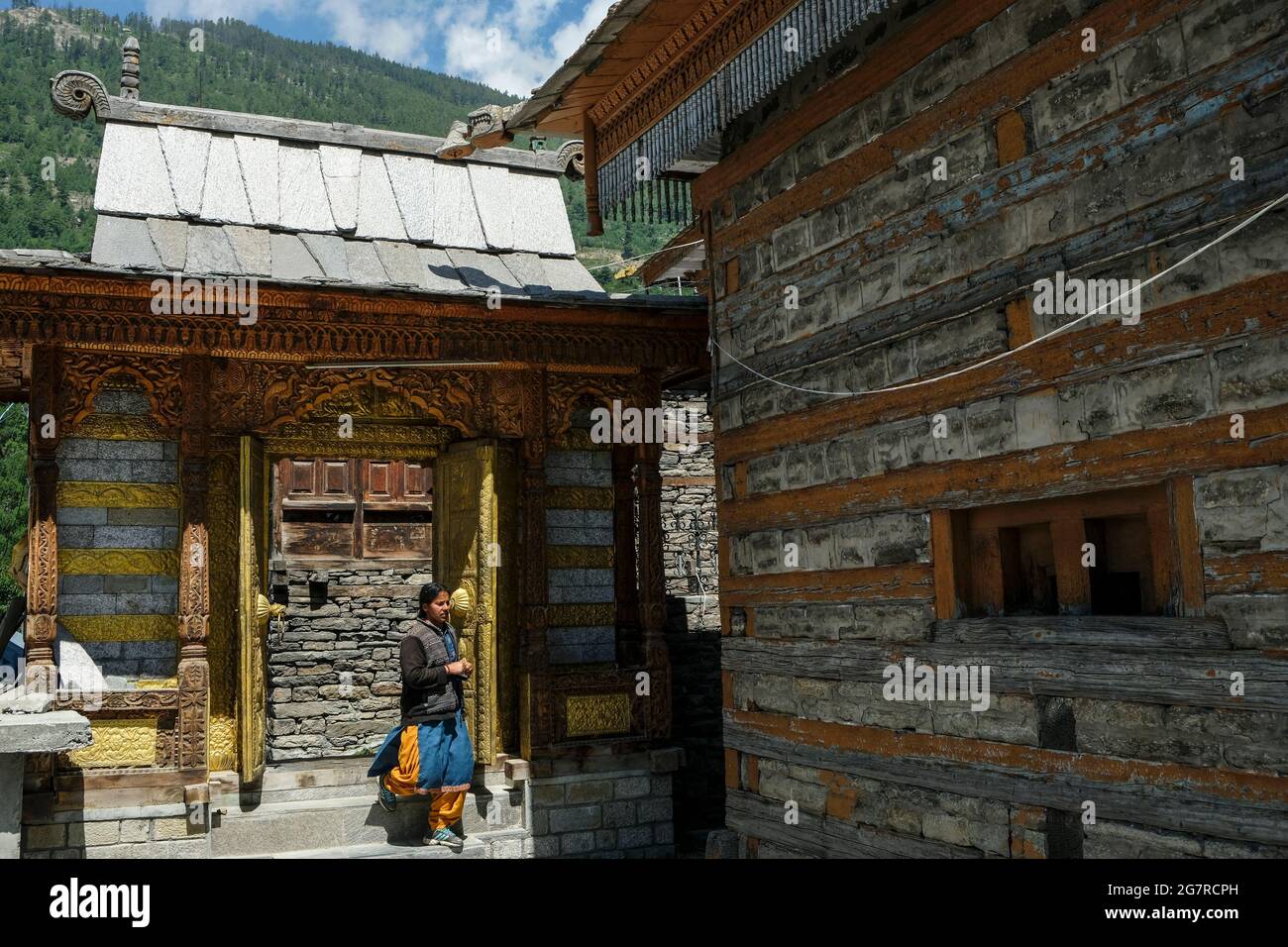 Kalpa, India - July 2021: A woman entering the Hindu temple of Narayan ...
