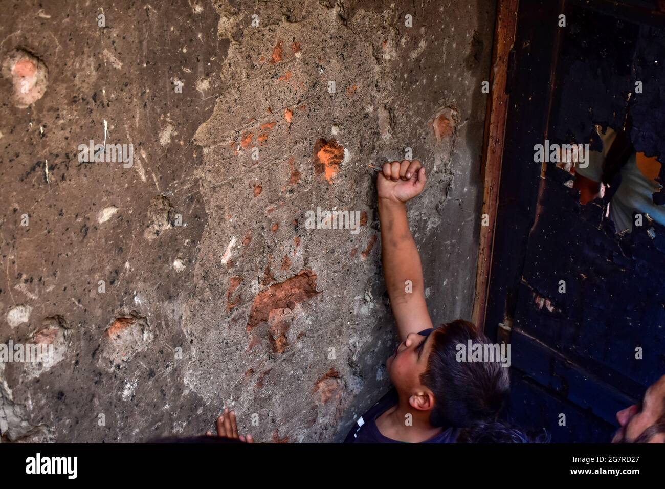 Bullet riddled wall hi-res stock photography and images - Alamy