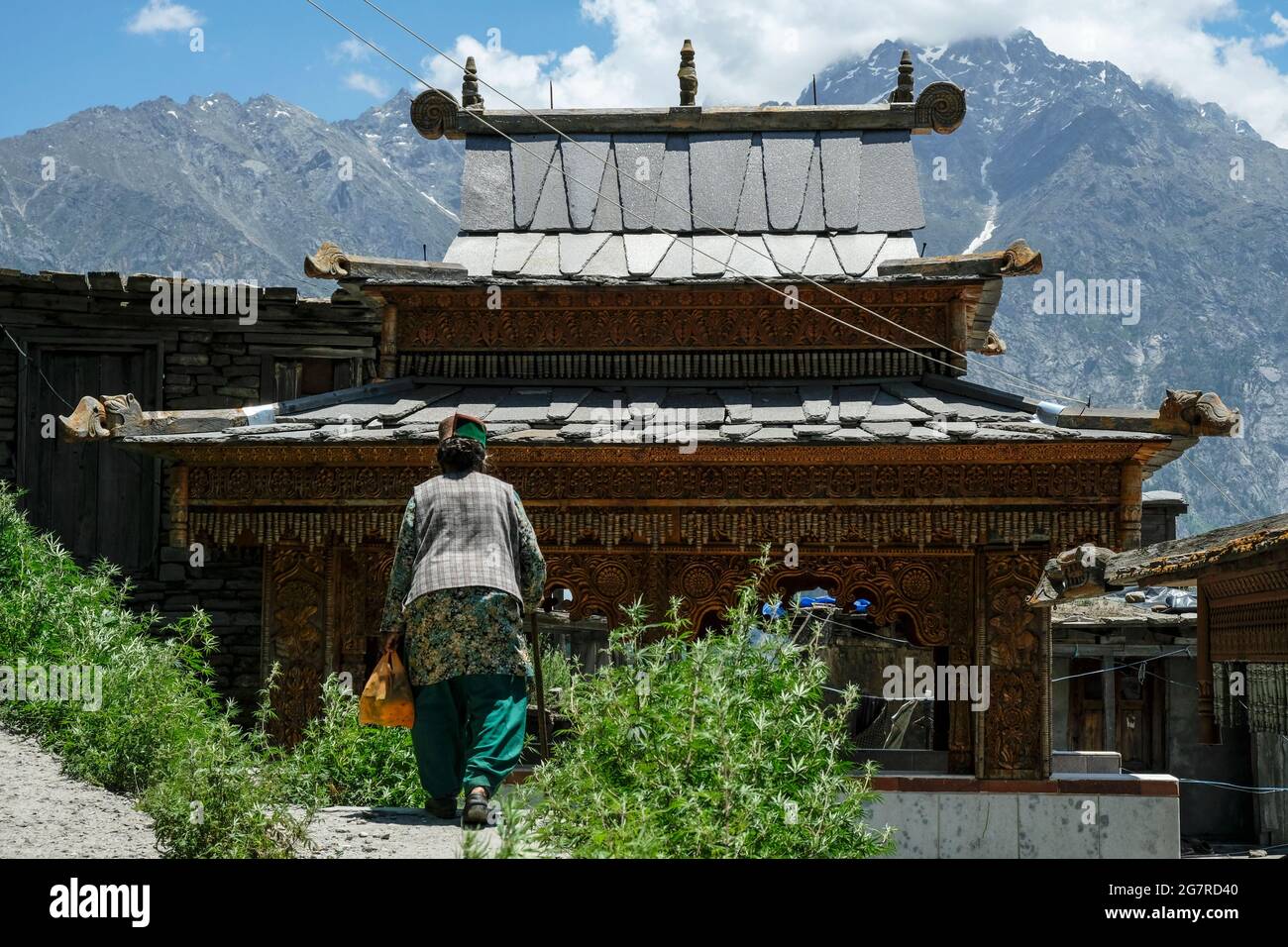 Kalpa, India - July 2021: A woman leaving the Hindu temple of Narayan ...