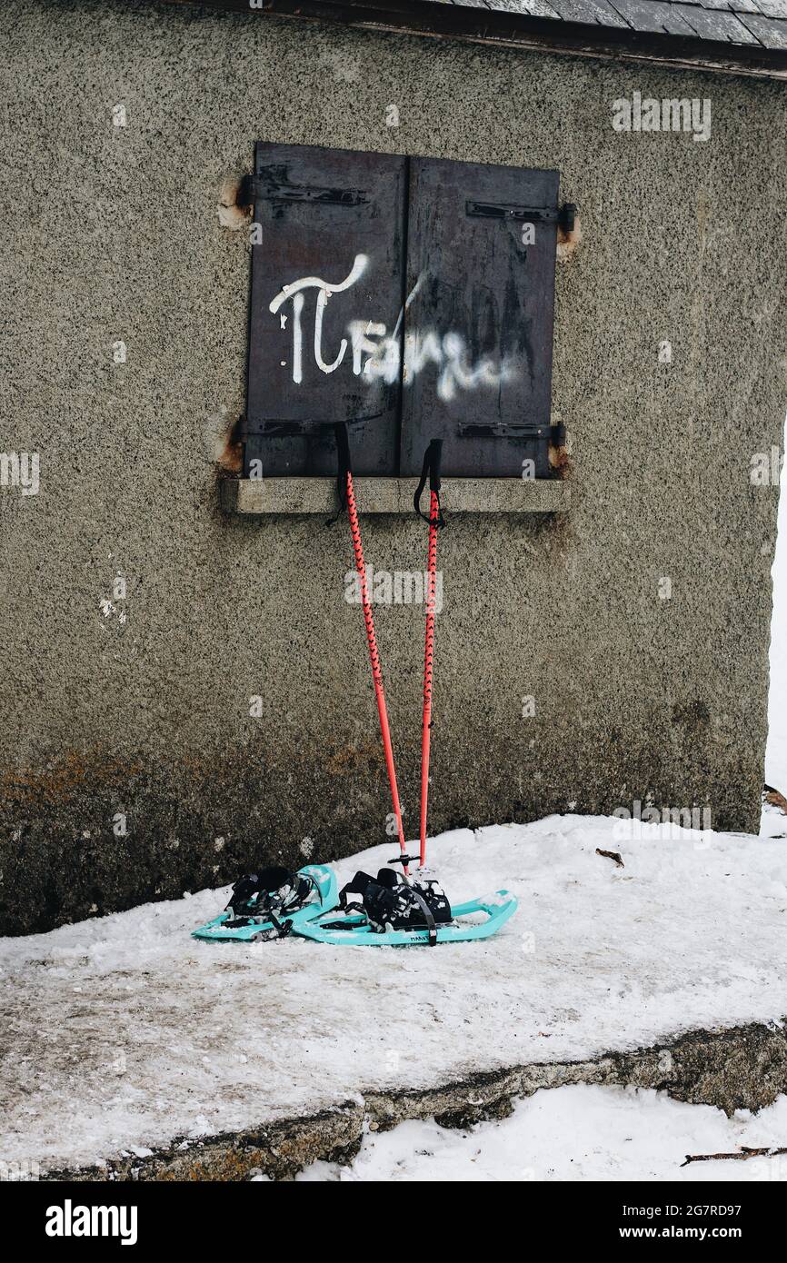 Vertical shot of skis near an old concrete wall Stock Photo - Alamy