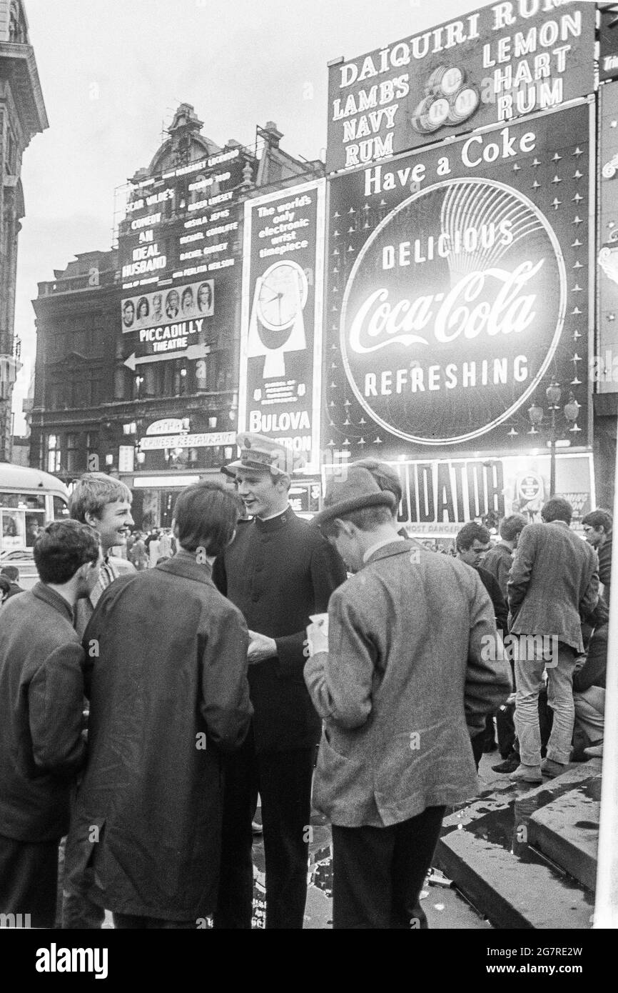 an officer from The Salvation Army (Regent Hall), London talks to young ...