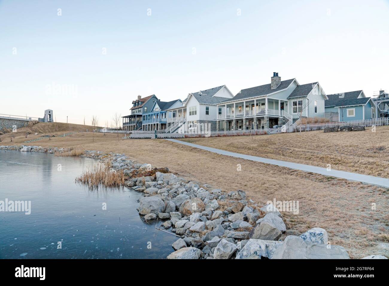 Residential buildings exterior near the lake with rocky shorelines ...
