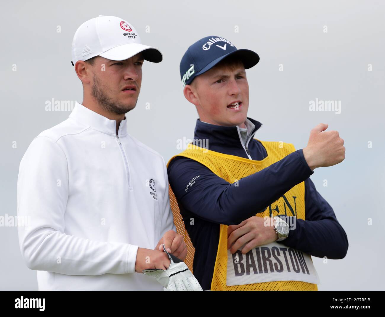 England's Sam Bairstow speaks with his caddie during day two of The Open at The Royal St George ...
