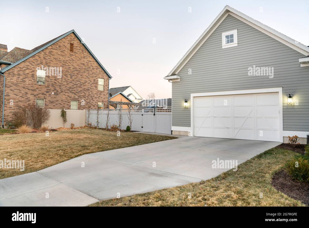 Detached garage with closed white door and gable design exterior Stock ...