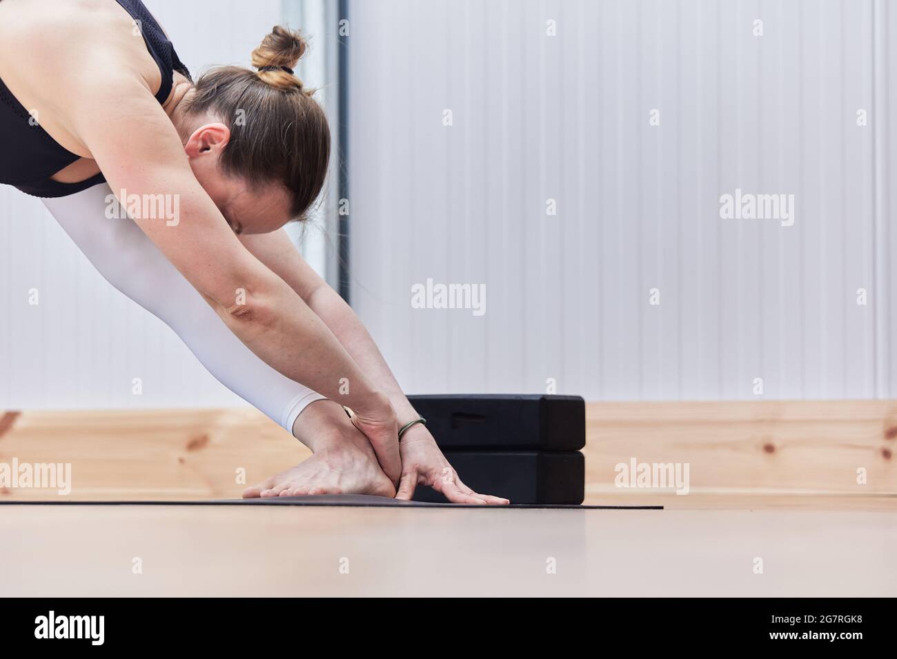 very closed image of a woman stretching on a mat Stock Photo - Alamy