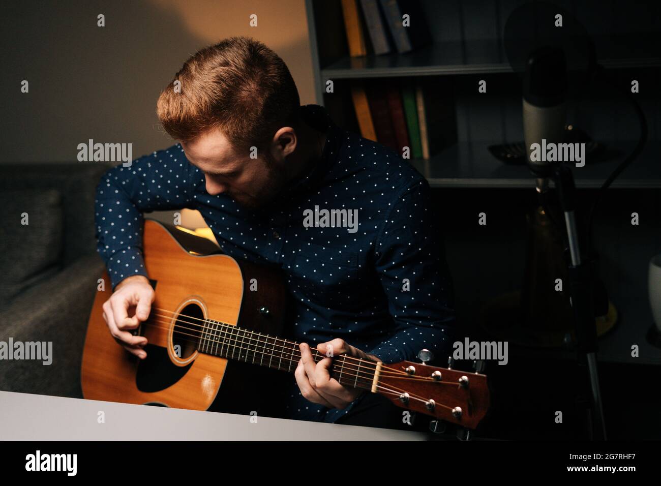 Portrait of talented guitarist singer man play on acoustic guitar ...