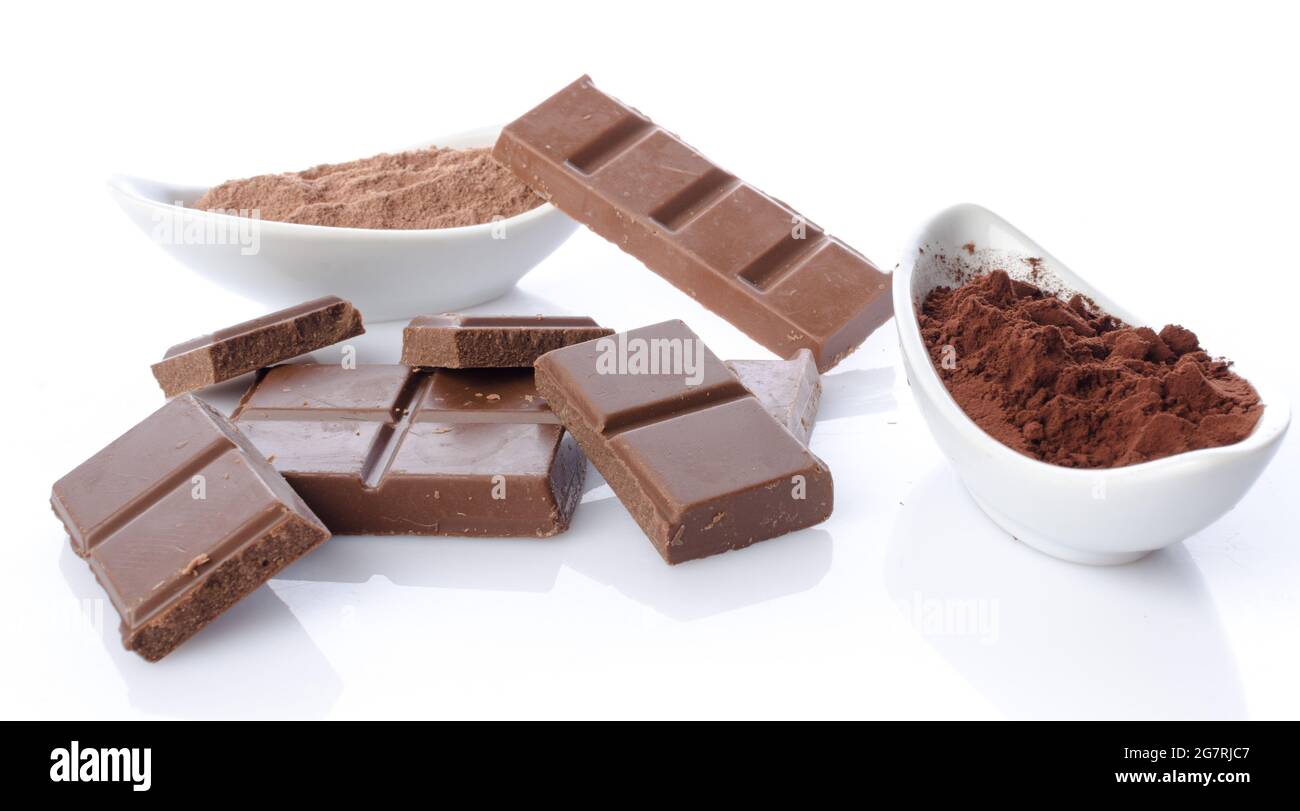 Chocolate squares and cocoa powder, isolated on white Stock Photo - Alamy