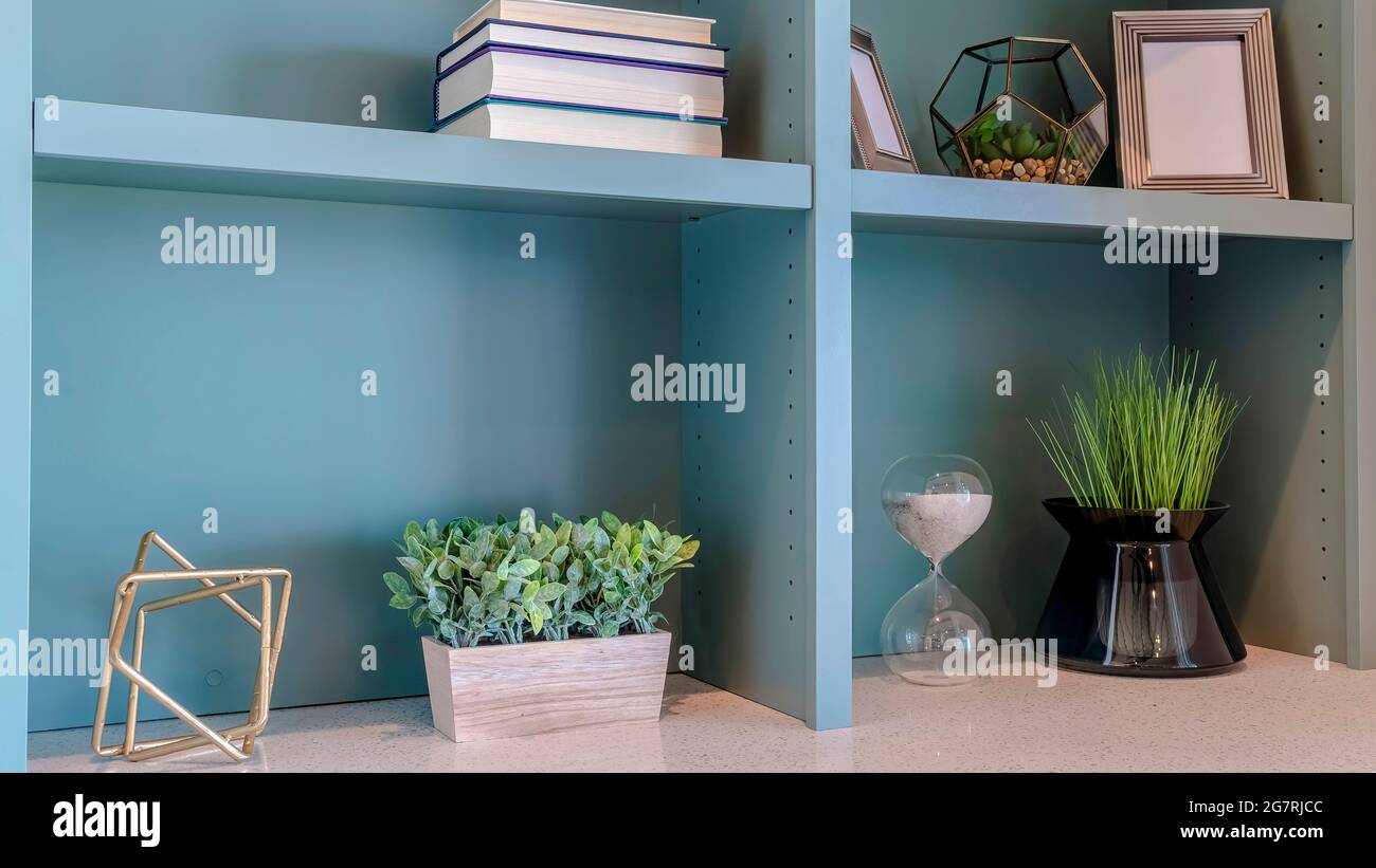 Pano Living room interior with close up of the display shelves of built ...