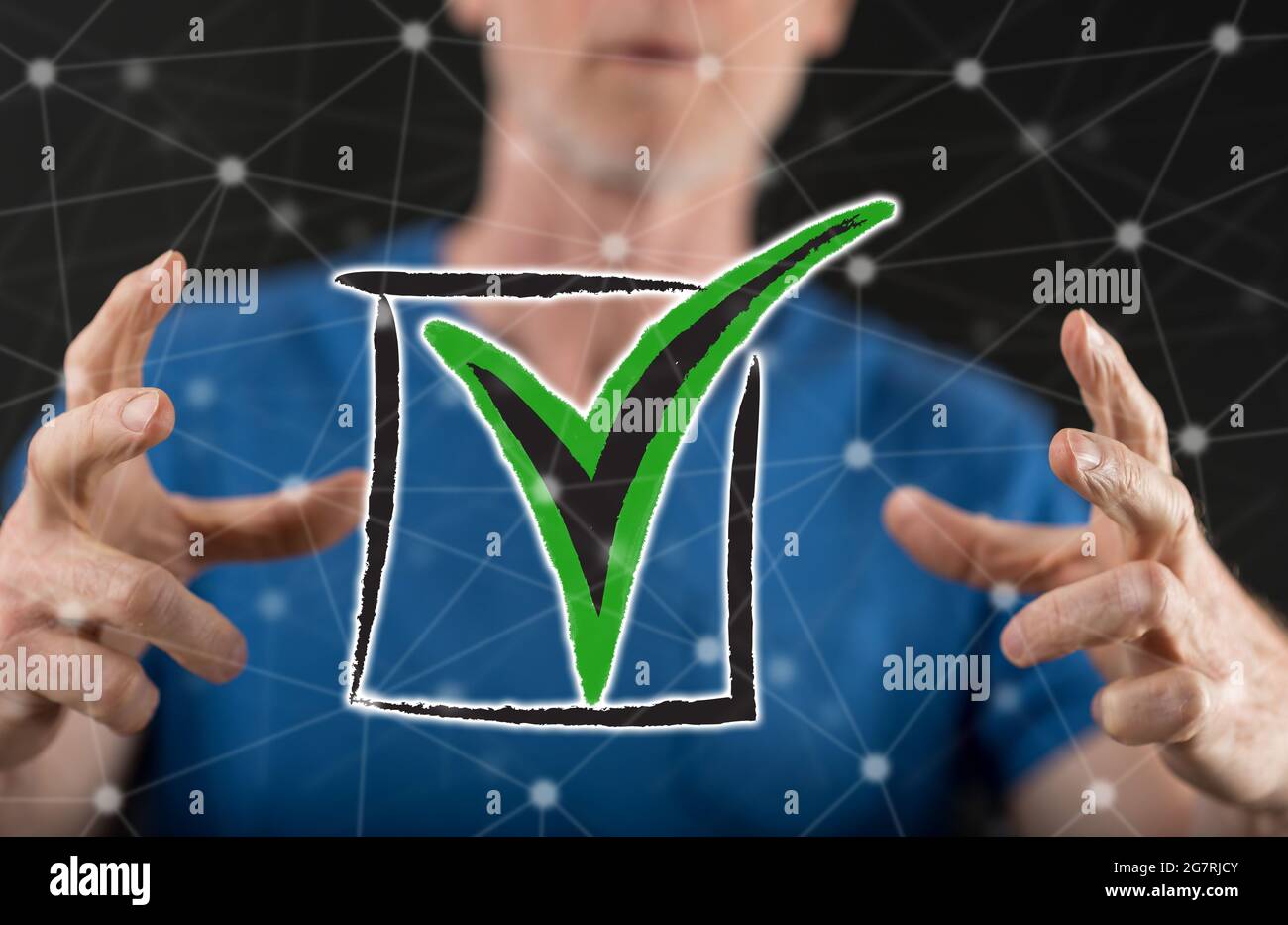 Validation concept between hands of a man in background Stock Photo - Alamy