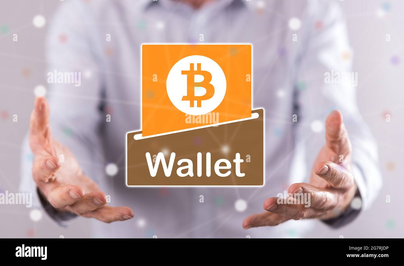 Bitcoin wallet concept above the hands of a man in background Stock ...