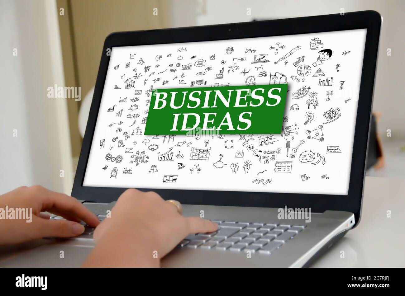 Hands on a laptop with screen showing business ideas concept Stock ...