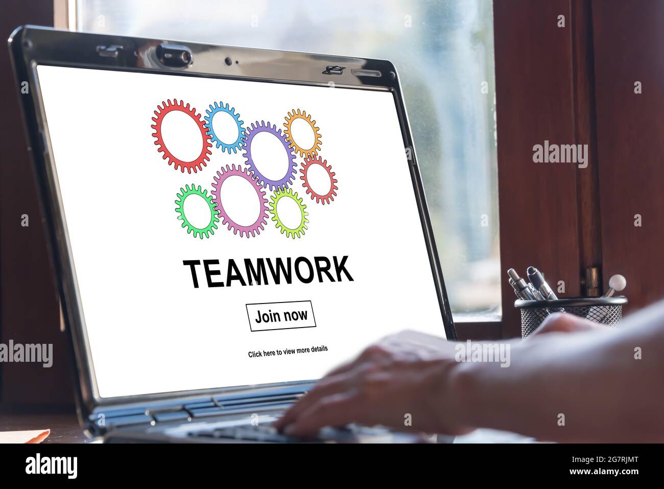 Laptop screen displaying a teamwork concept Stock Photo - Alamy