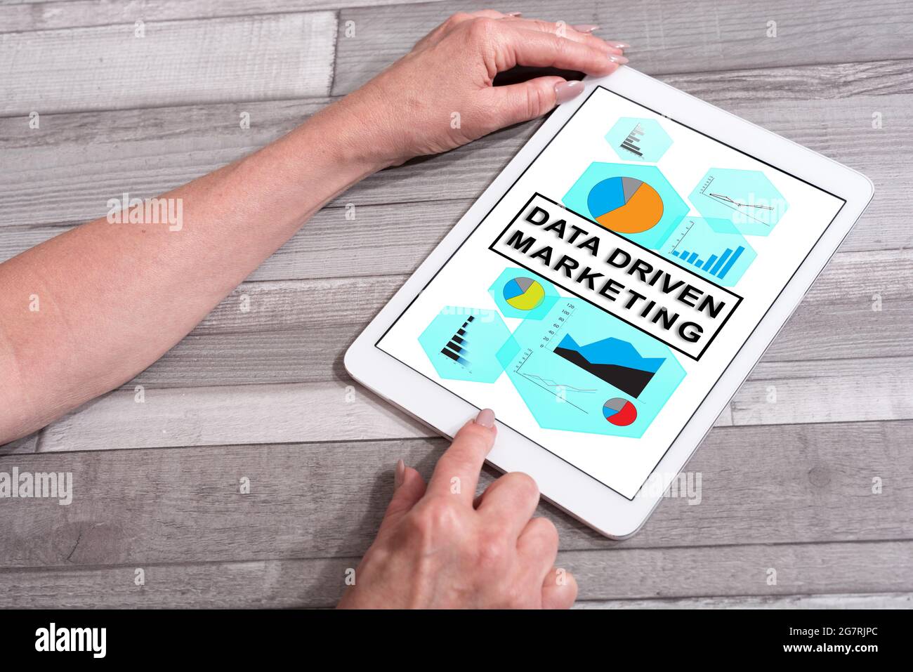Data driven marketing concept shown on a tablet used by a woman Stock ...