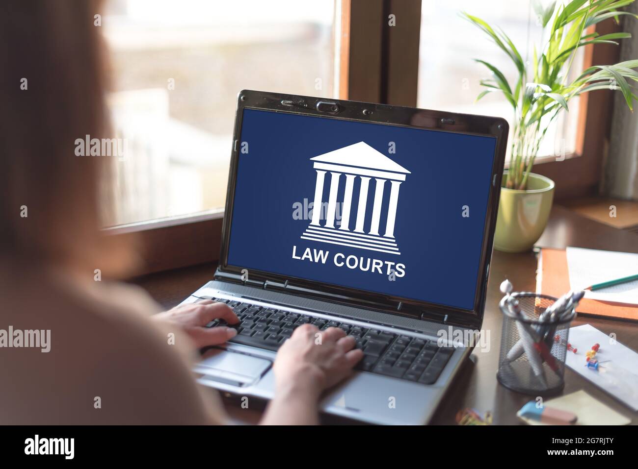 Laptop screen displaying a law courts concept Stock Photo - Alamy