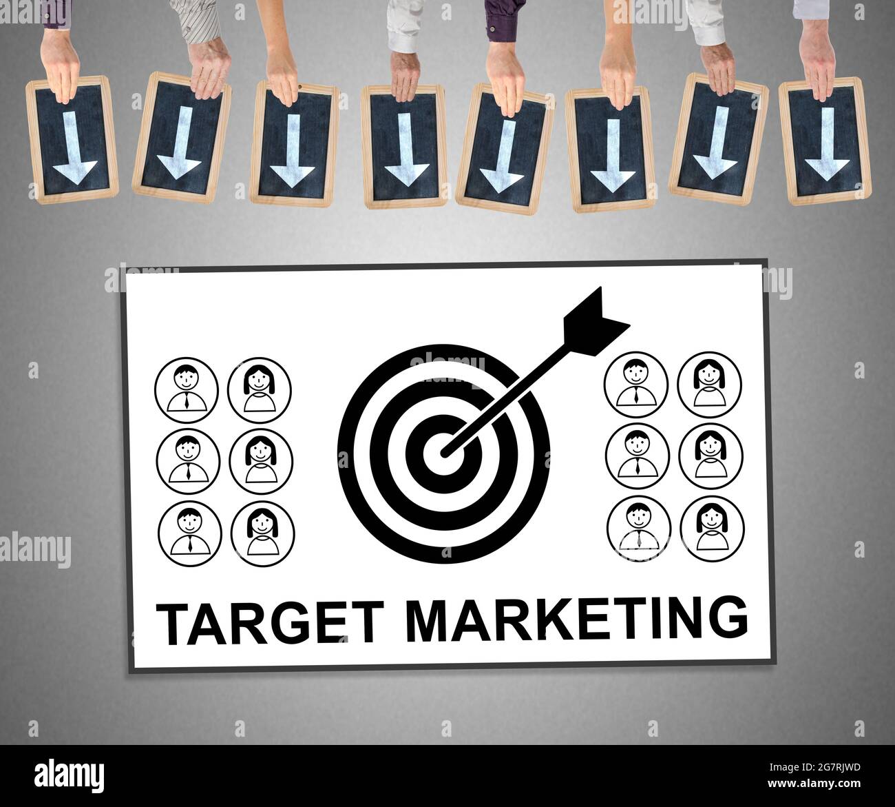Hands holding writing slates with arrows pointing on target marketing ...