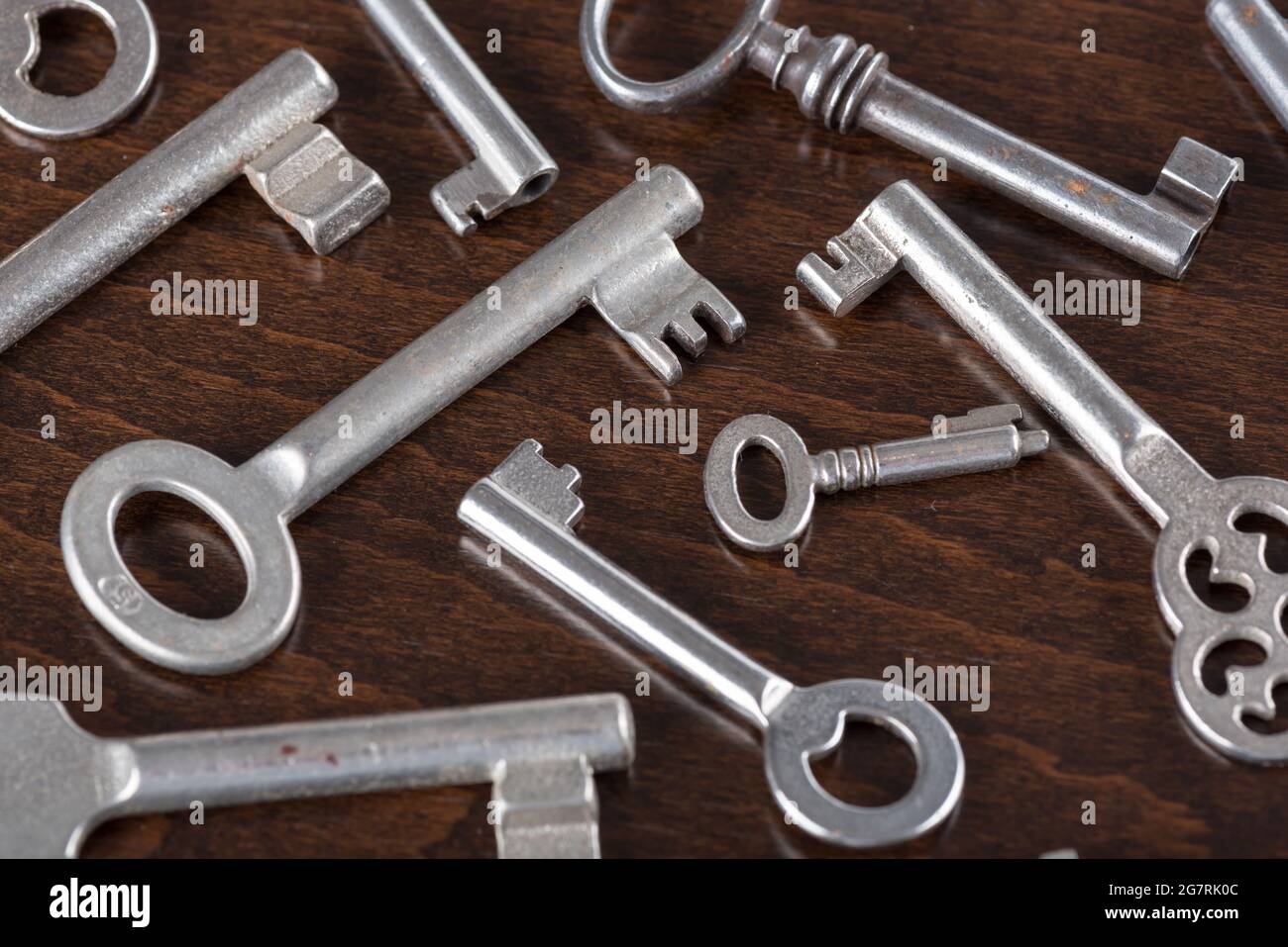 Old keys on wooden background Stock Photo - Alamy