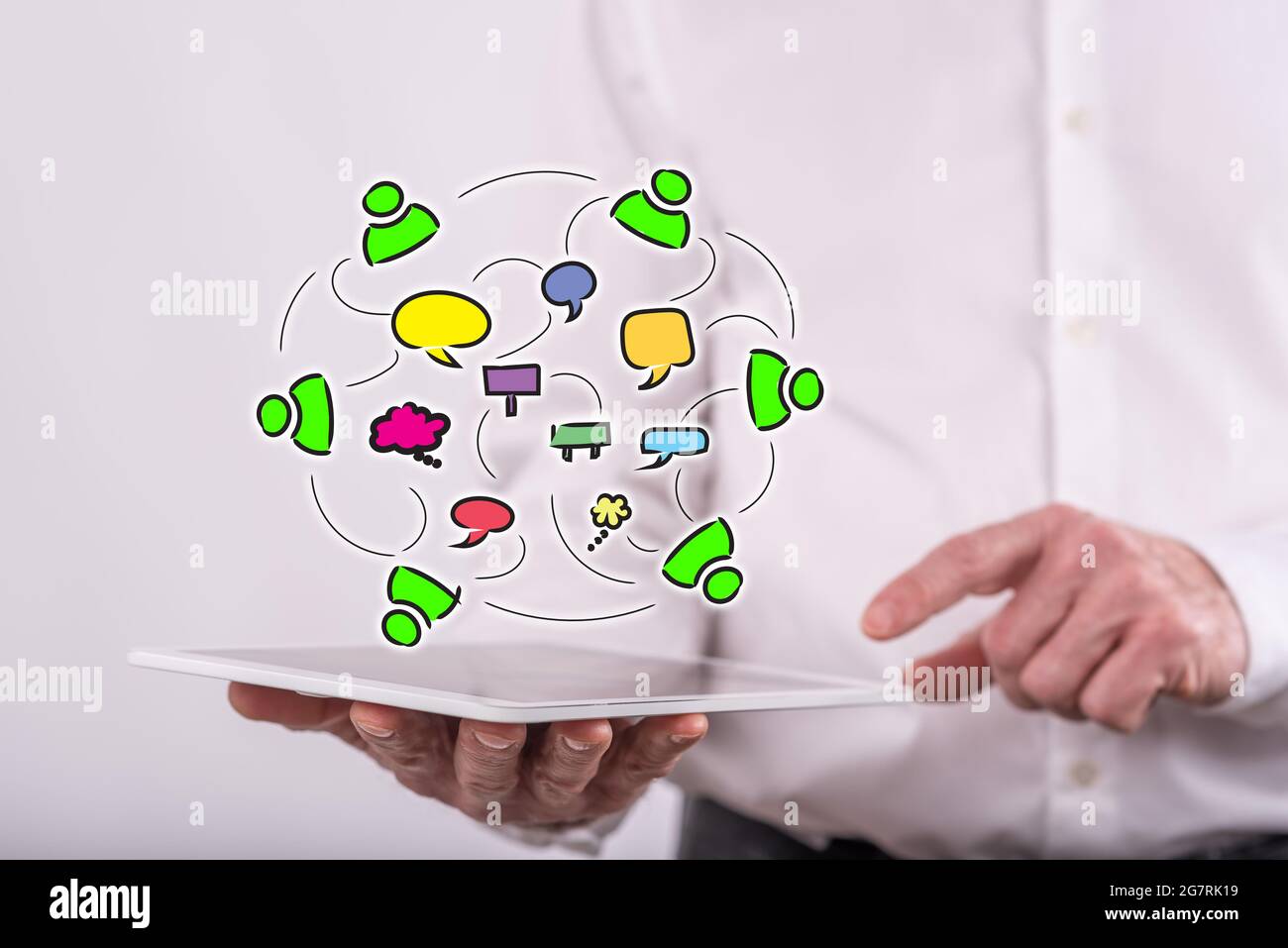 Communication concept above a tablet held by a man in background Stock ...