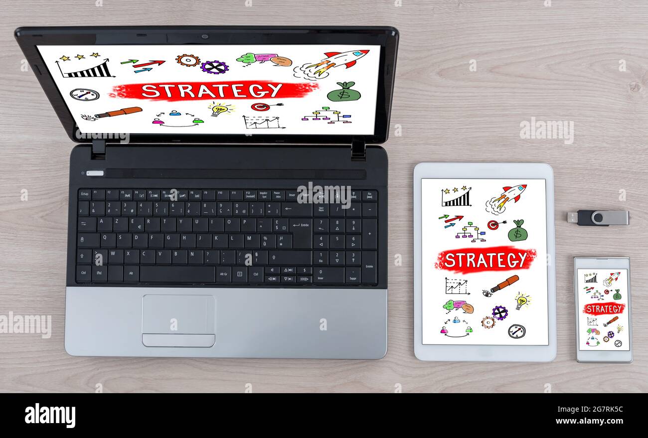 Business strategy concept shown on different information technology ...