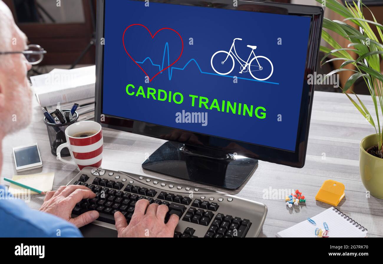 Man using a computer with cardio training concept on the screen Stock ...