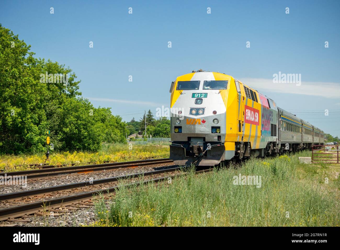 VIA Passenger Train 912 A GE P42DC Diesel Locomotive In Canada 150 Livery Passing Through ...