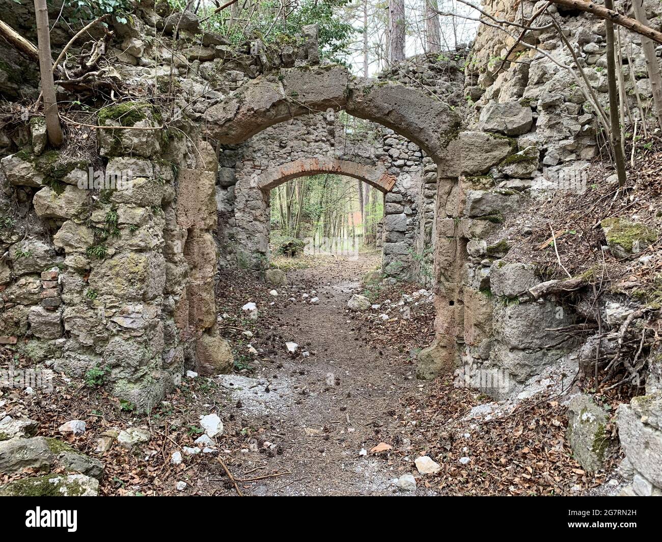 Ruins of an old structure from medieval times with brick arches leading ...