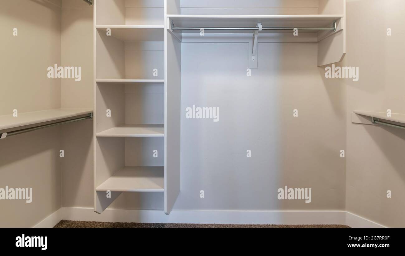 Pano Interior of a small walk-in closet with carpeted floor Stock Photo ...