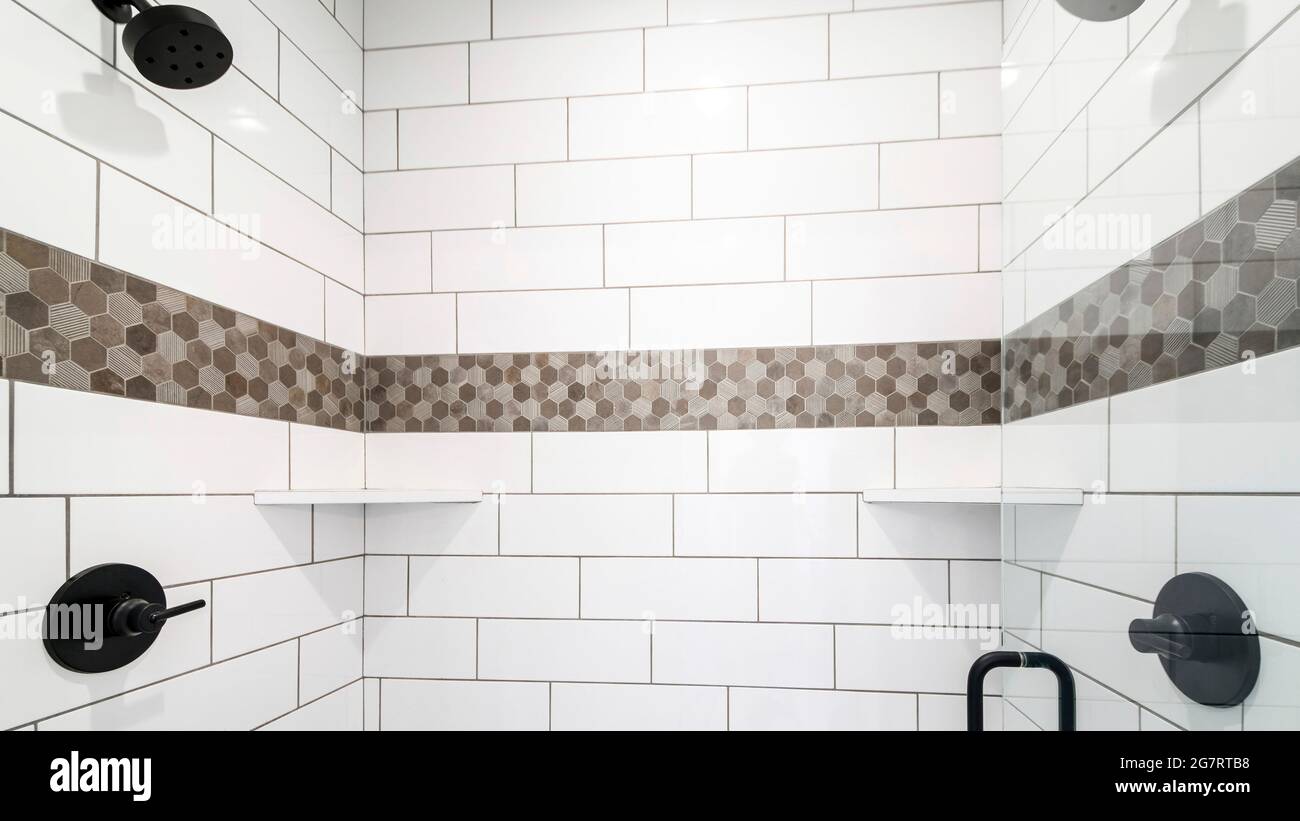 Pano Shower stall with decorative tile walls outline and opened ...