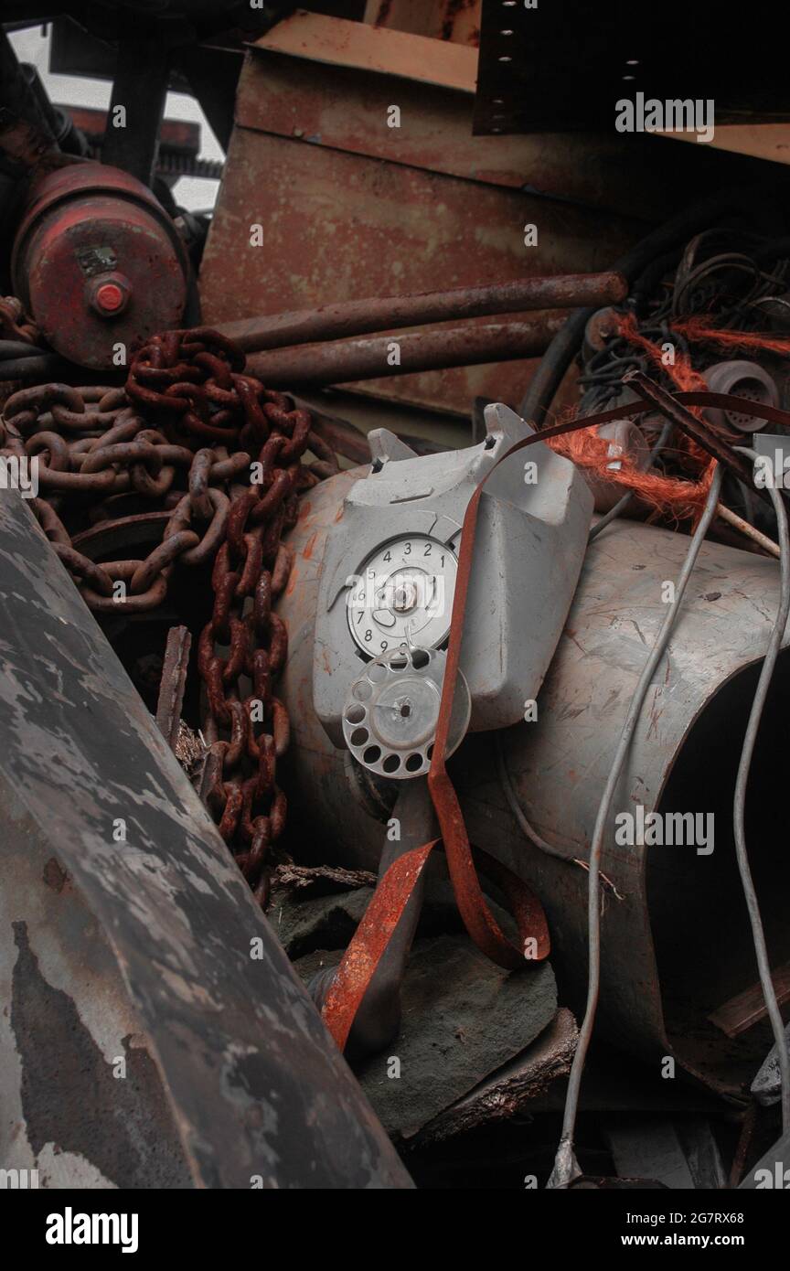 Old broken telephone amongst scrap metal Stock Photo - Alamy
